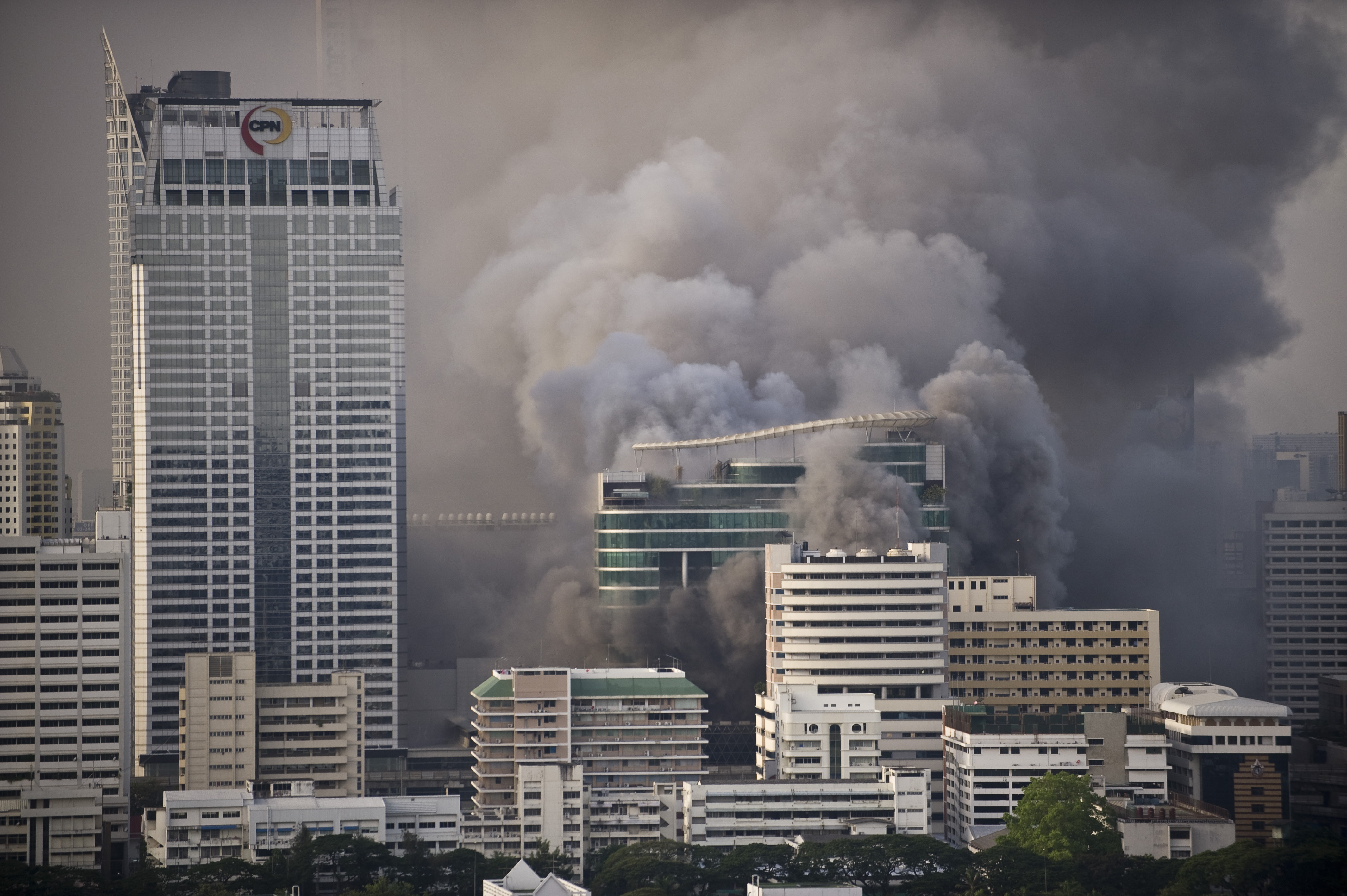 In Bangkok, Riots and Fires Erupt as Red Shirt Leaders Surrender | PBS News